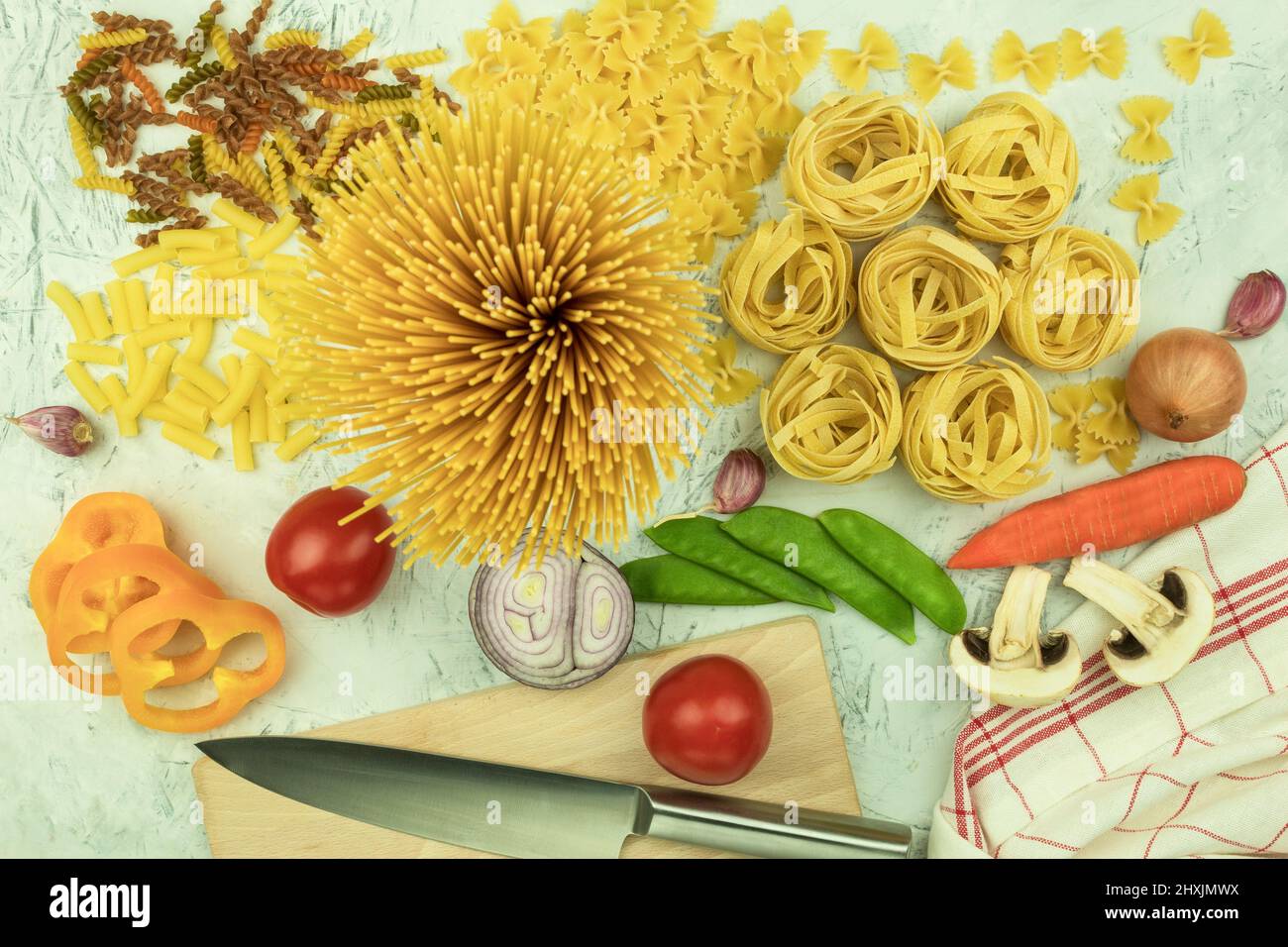 Assorted different types of pasta on the table. Various types of raw ...