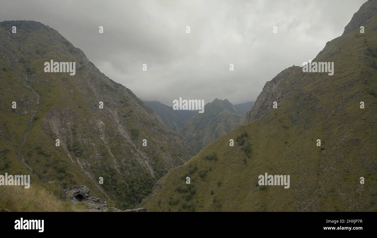 Aerial view of a picturesque gorge on heavy cloudy sky background ...