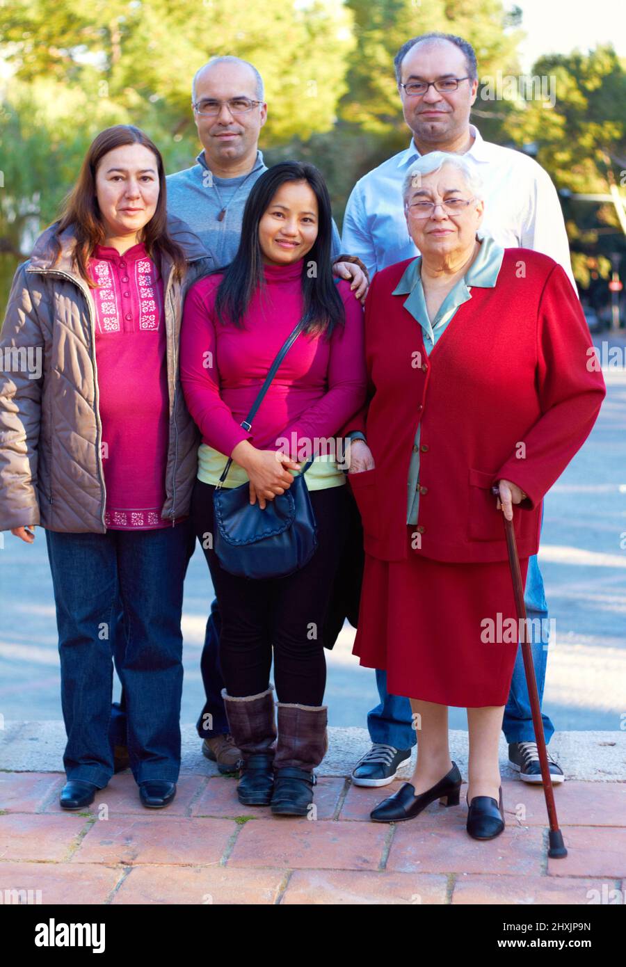 Family ties. A portrait of a multi-generational family Stock Photo - Alamy