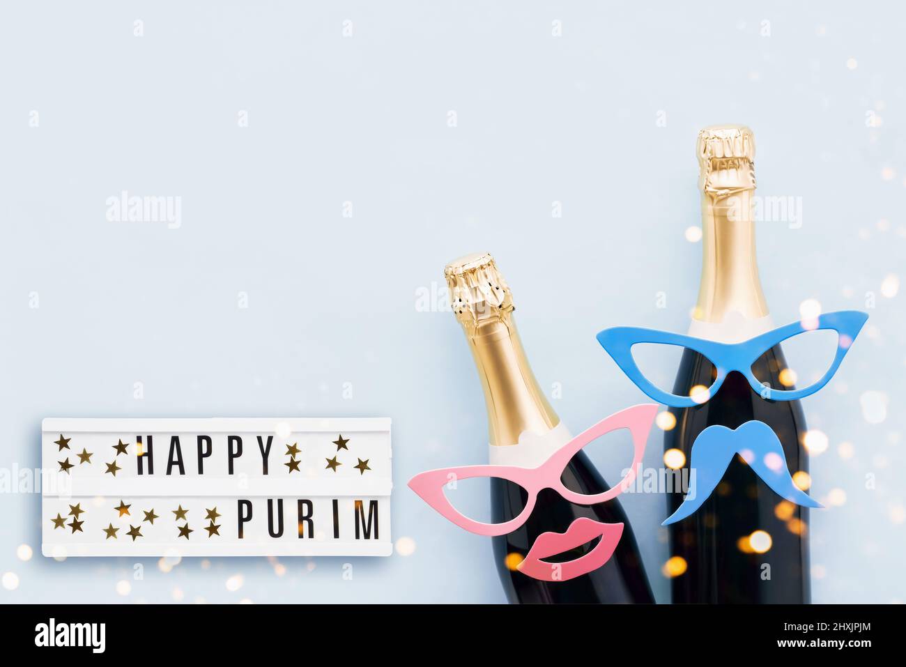 Purim background. Happy Purim written in lightbox, party props, masks ...