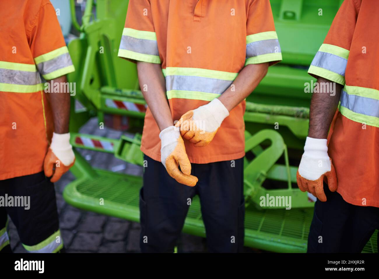 Collecting your trash. Cropped shot of a garbage collection team Stock ...