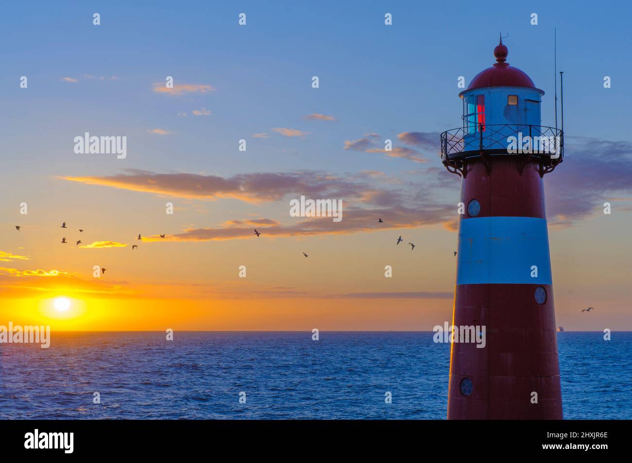 Sunset at lighthouse "Noorderhoofd" of Westkapelle, Zeeland ...