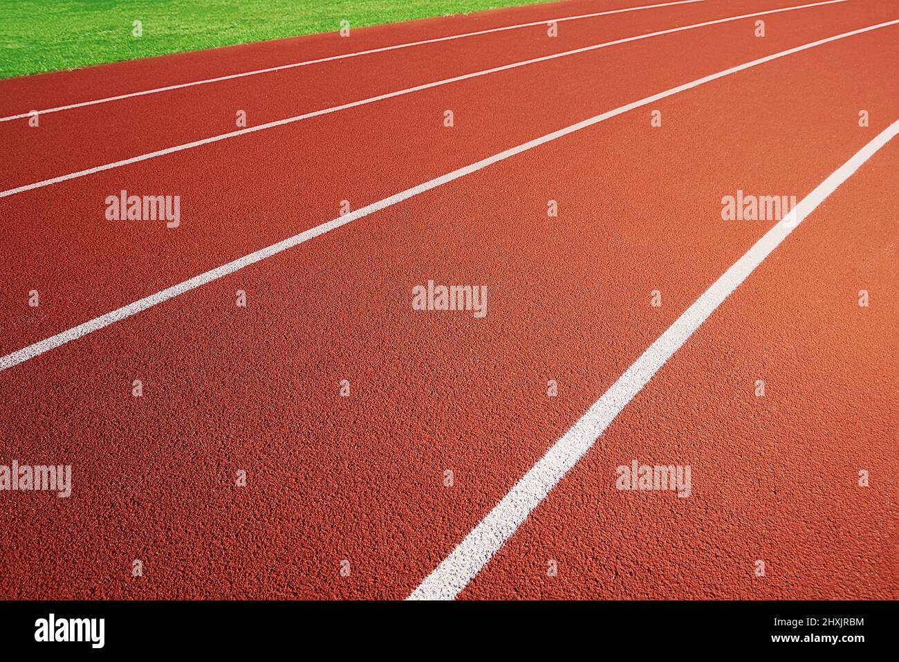 Red runninng race track with border lanes closeup, Treadmill at stadium ...