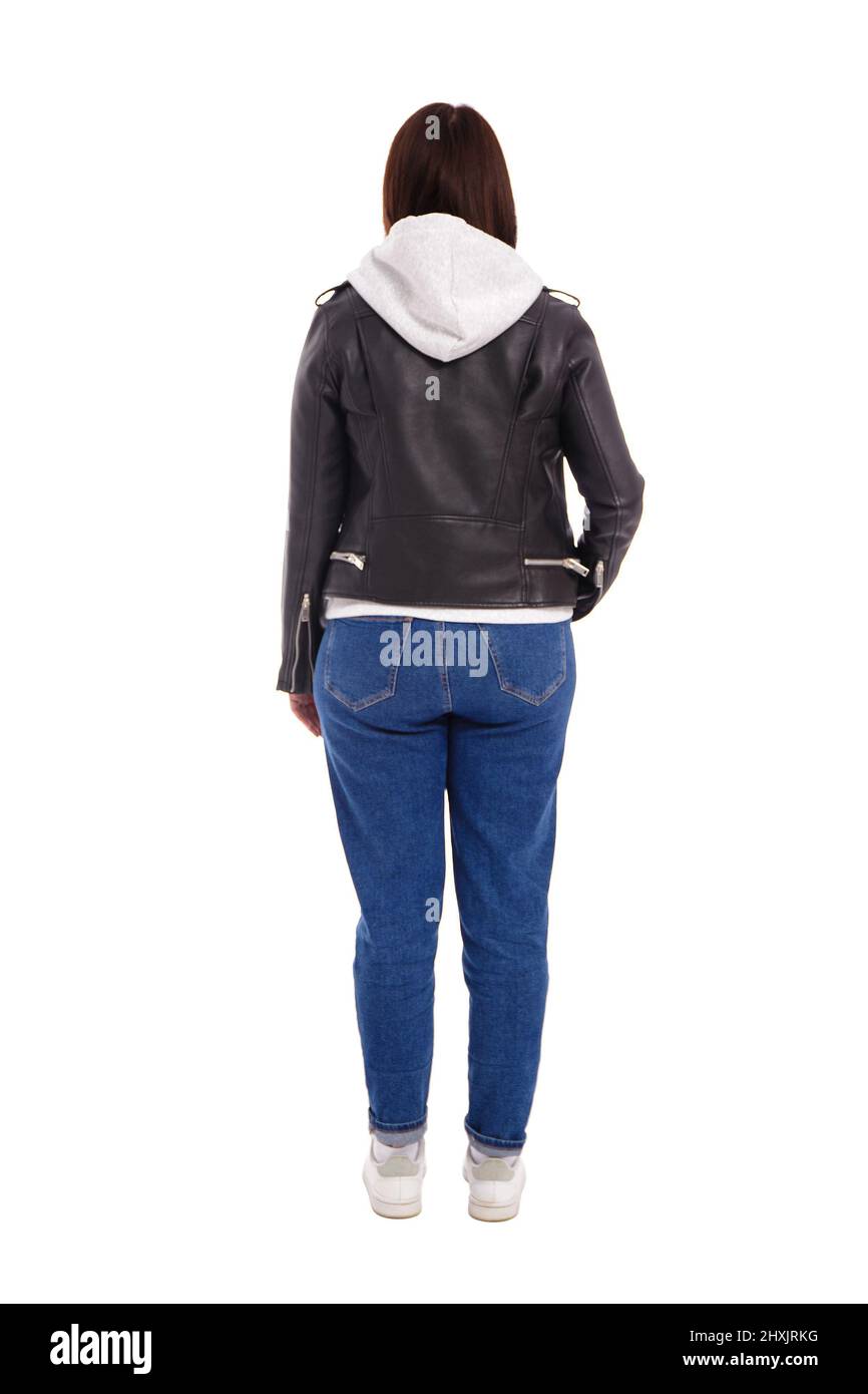 back view of young woman posing in jeans, hoodie and black leather ...