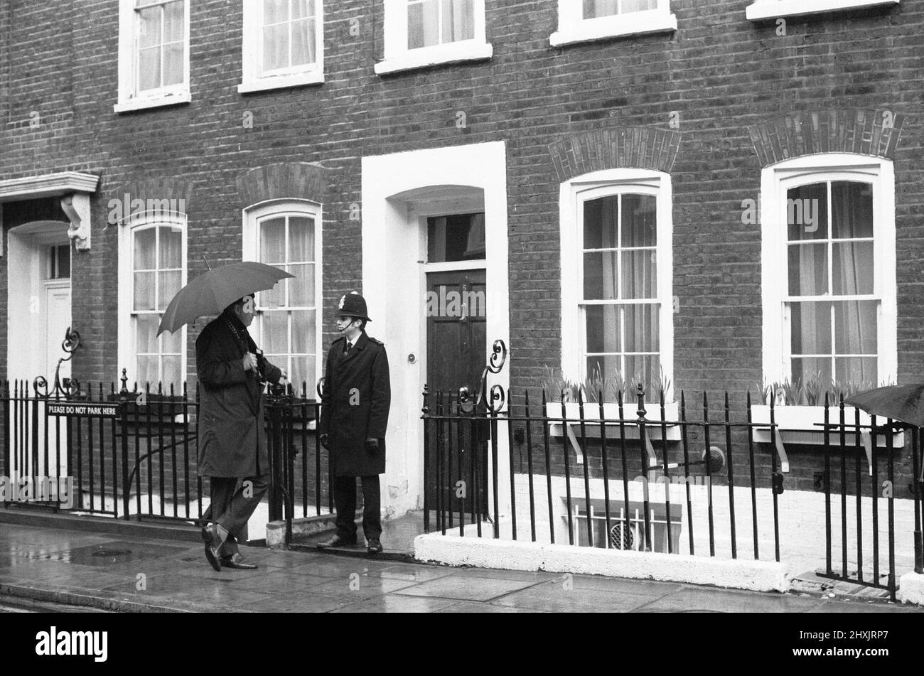 Press photographer chats with the police constable standing guard at ...