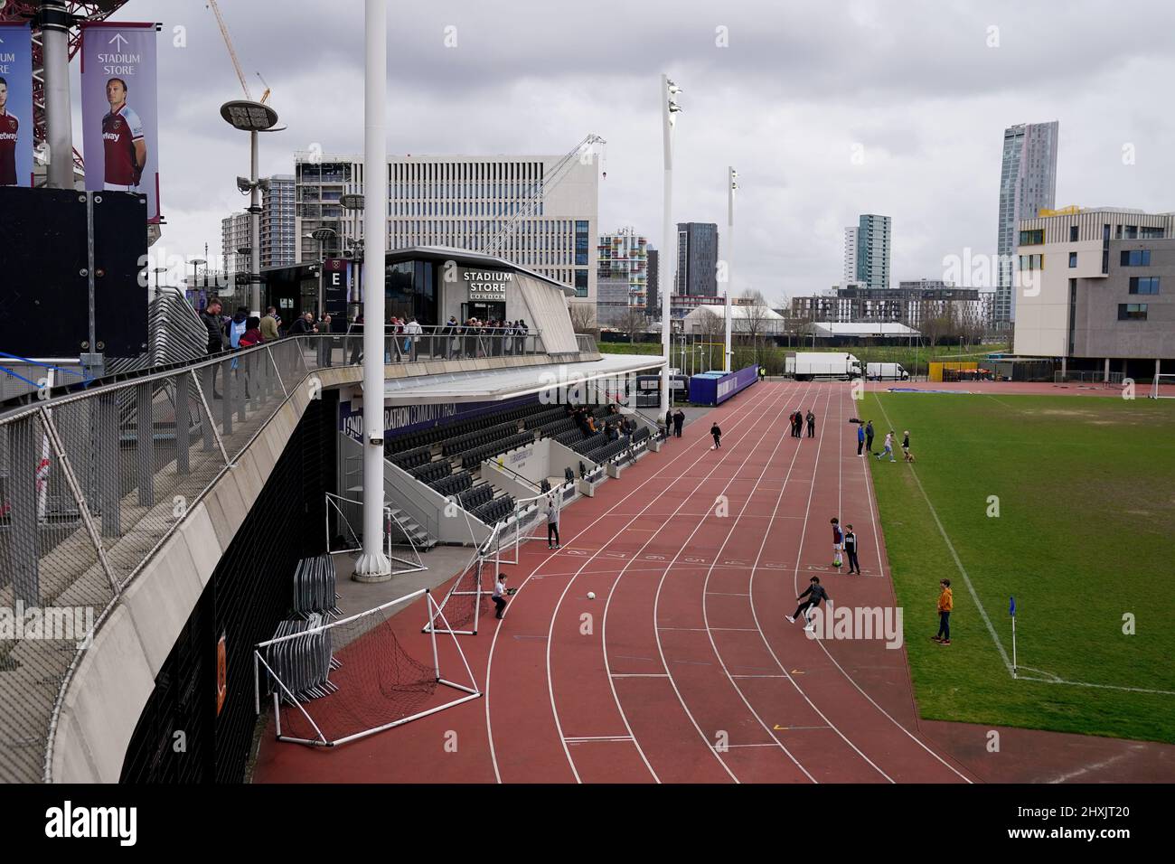 Kids play football at the London Marathon Community Track outside the ...