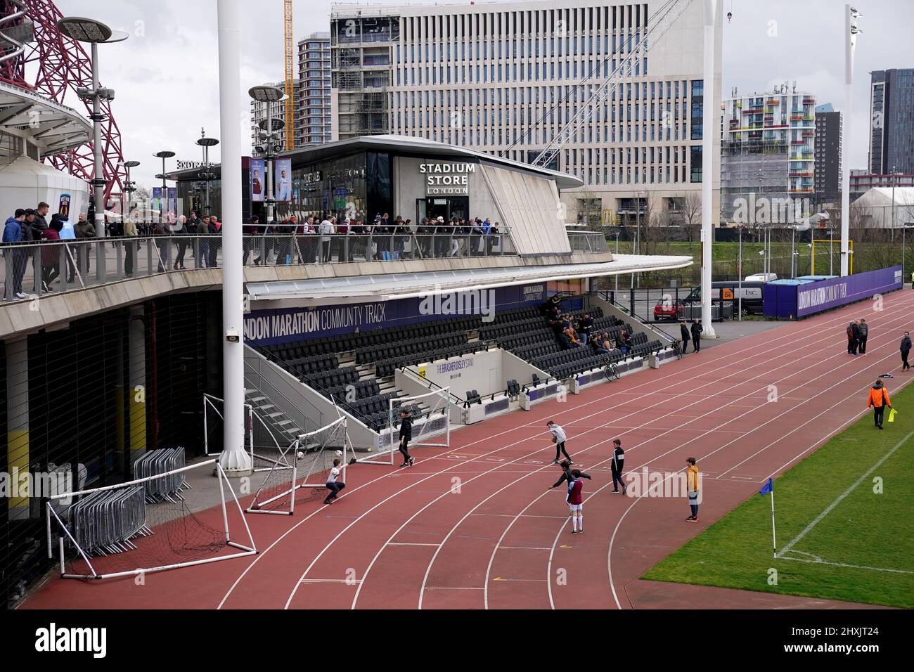 Kids play football at the London Marathon Community Track outside the ...