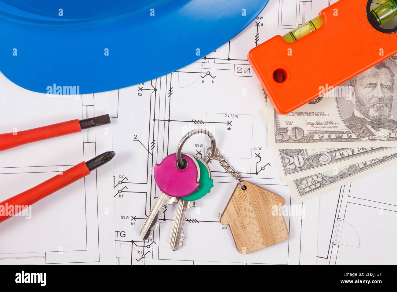 Keys with house shape, currencies dollar and electrical construction ...