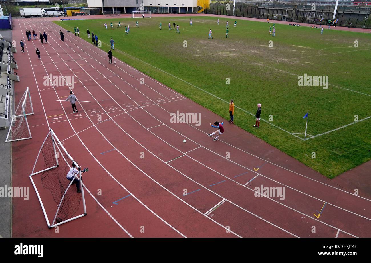Kids play football at the London Marathon Community Track outside the ...