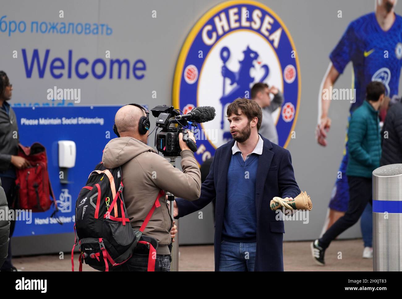 A TV crew conducts an interview outside Stamford Bridge, home of ...