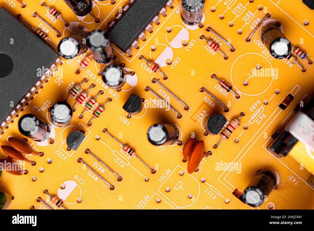 Macro Close up of components and microchips on old PC circuit board ...