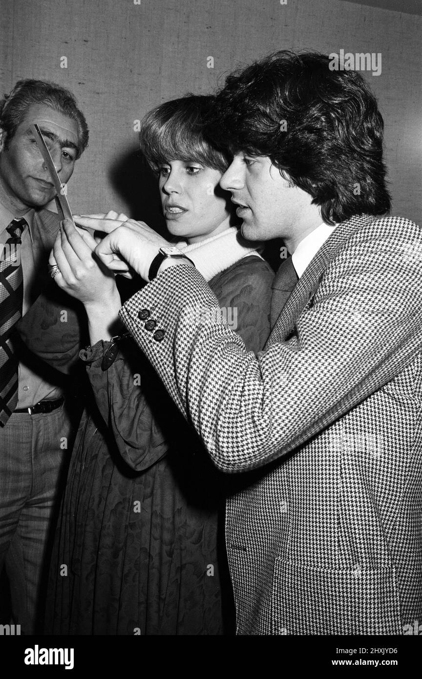 Actress Joanna Lumley judging a Purdey haircut lookalike contest with ...