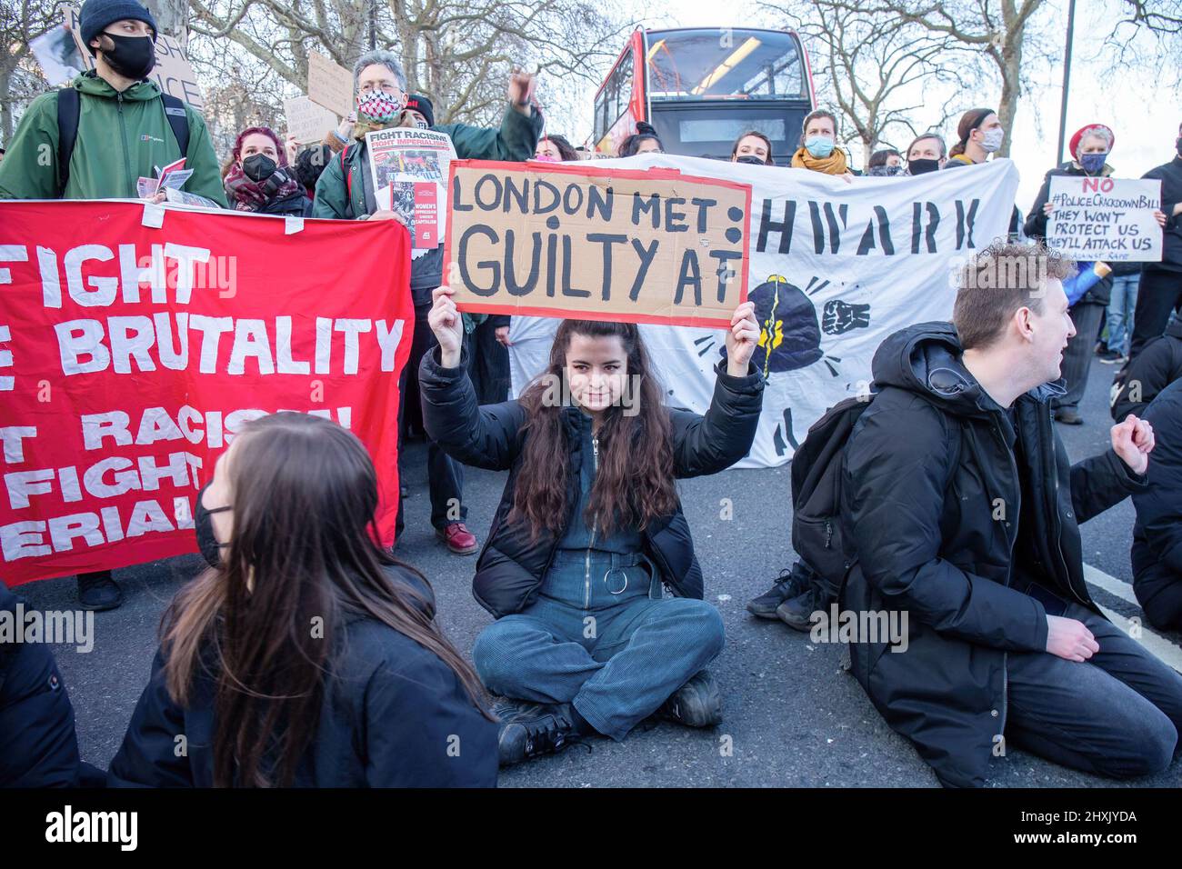 Protesters hold placards expressing their opinion during the ...