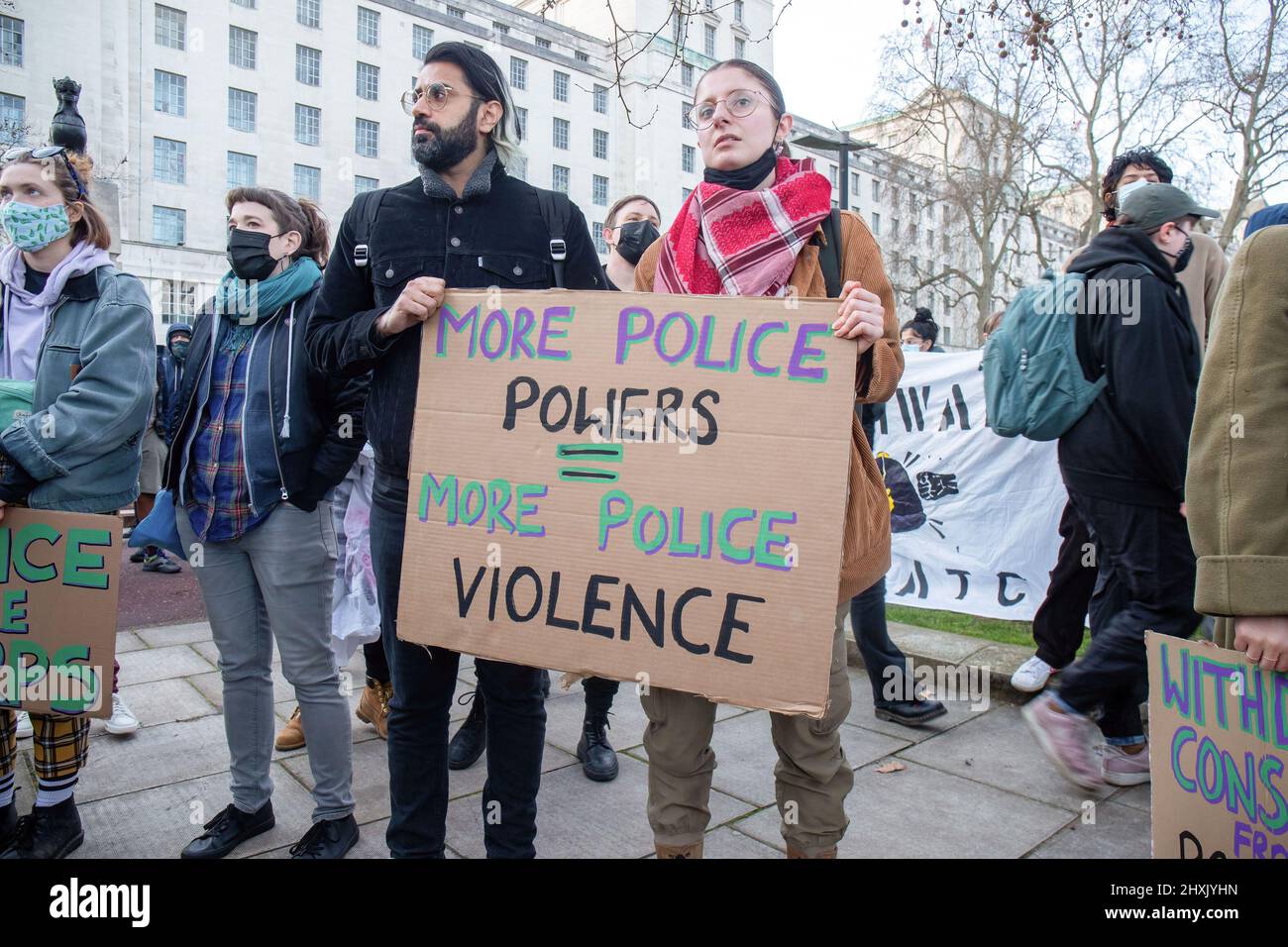London, UK. 12th Mar, 2022. Protesters hold a sign saying "More Police ...