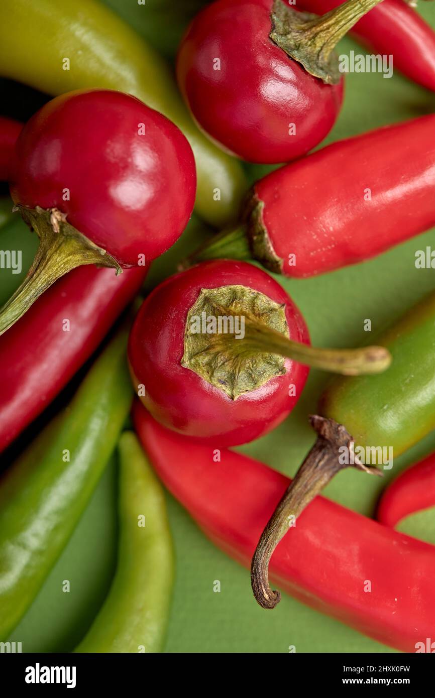 Creative layout of chili pepper on green background. Minimal food ...