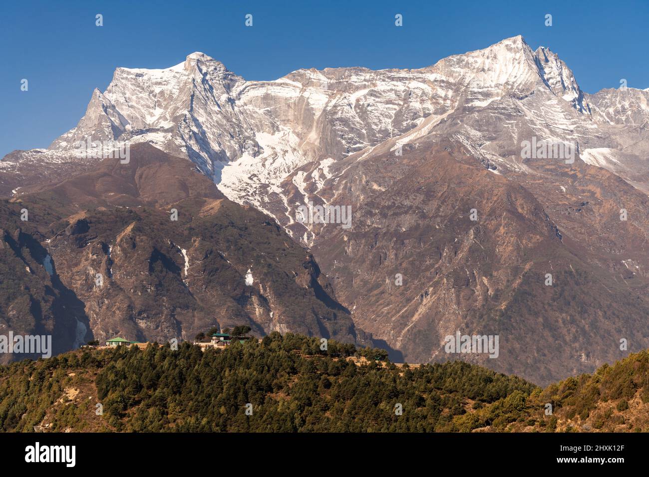 The big mountains in Nepal with a snow and blue sky on the background ...