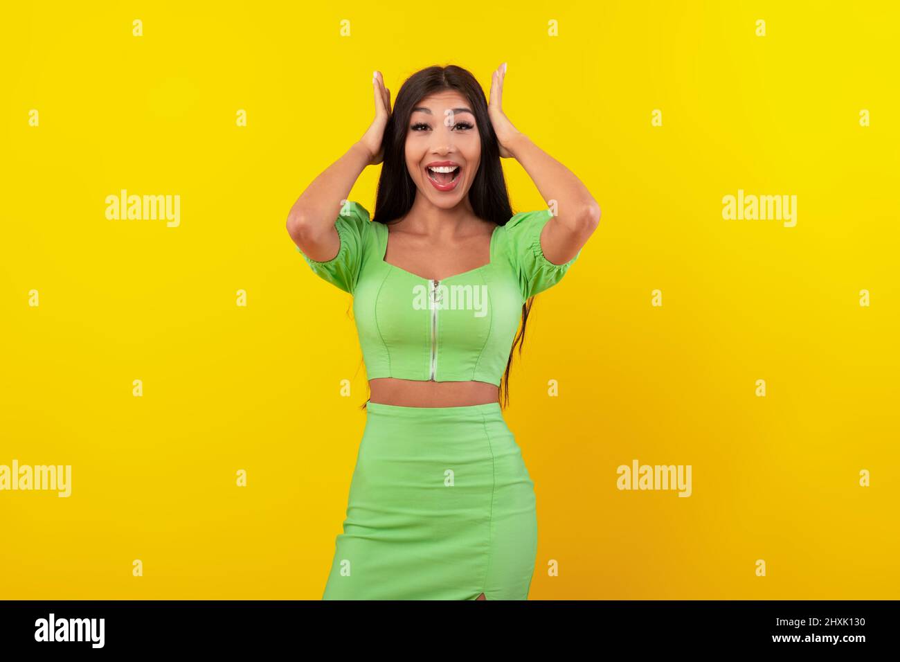 Excited woman with open mouth spreading hands Stock Photo - Alamy