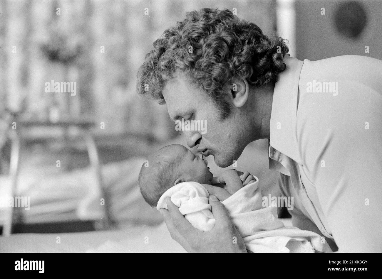 Former British European Heavyweight champion boxer Joe Bugner kisses ...