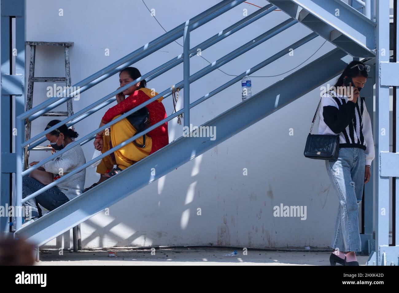 People form a queue outside the Passport Office in Kathmandu, Nepal on ...