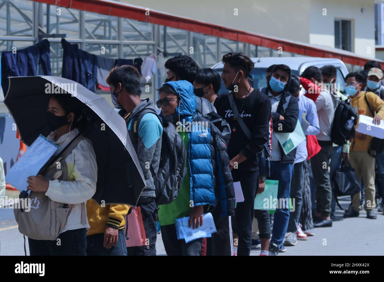 People form a queue outside the Passport Office in Kathmandu, Nepal on ...
