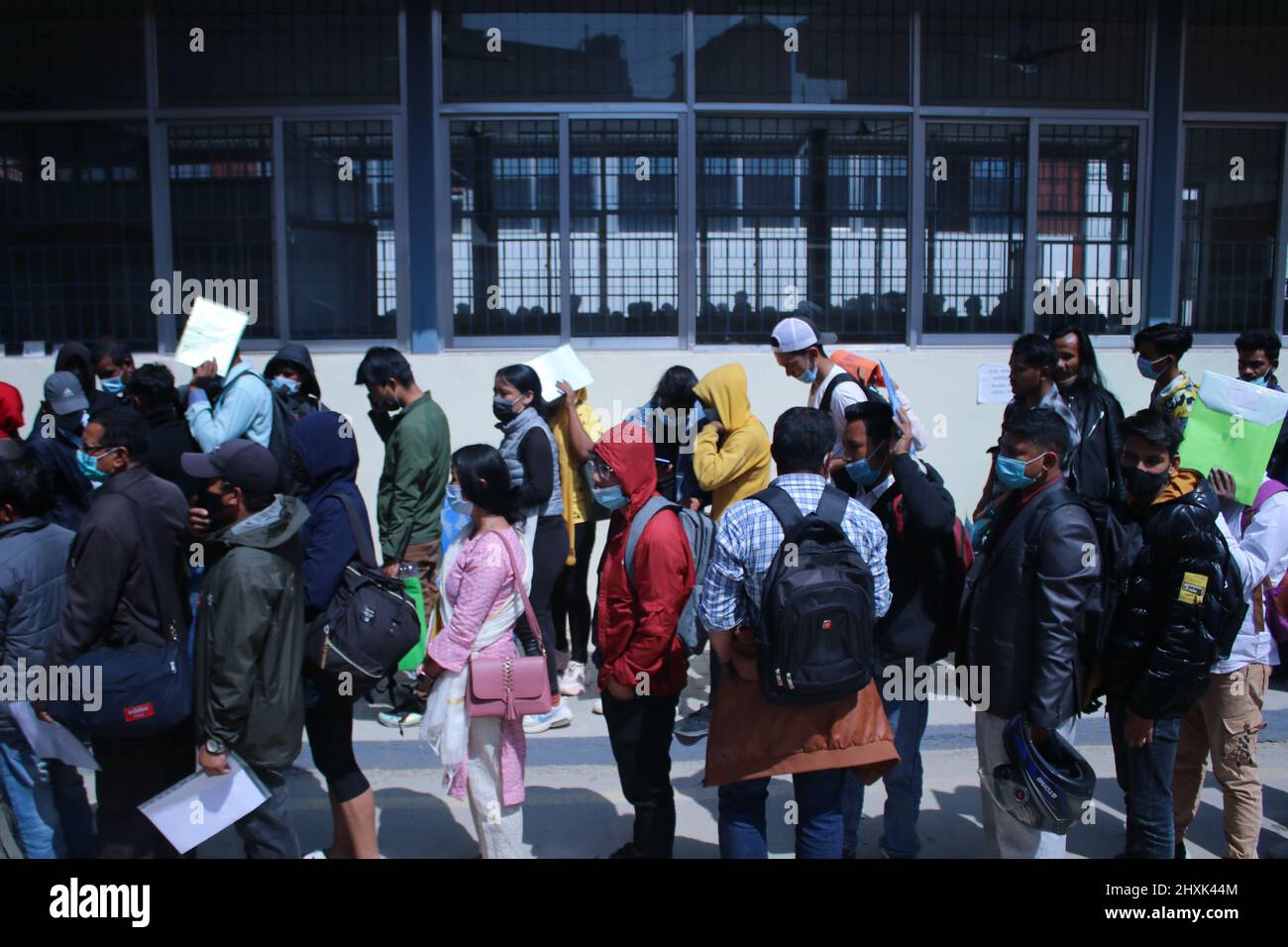 People form a queue outside the Passport Office in Kathmandu, Nepal on ...