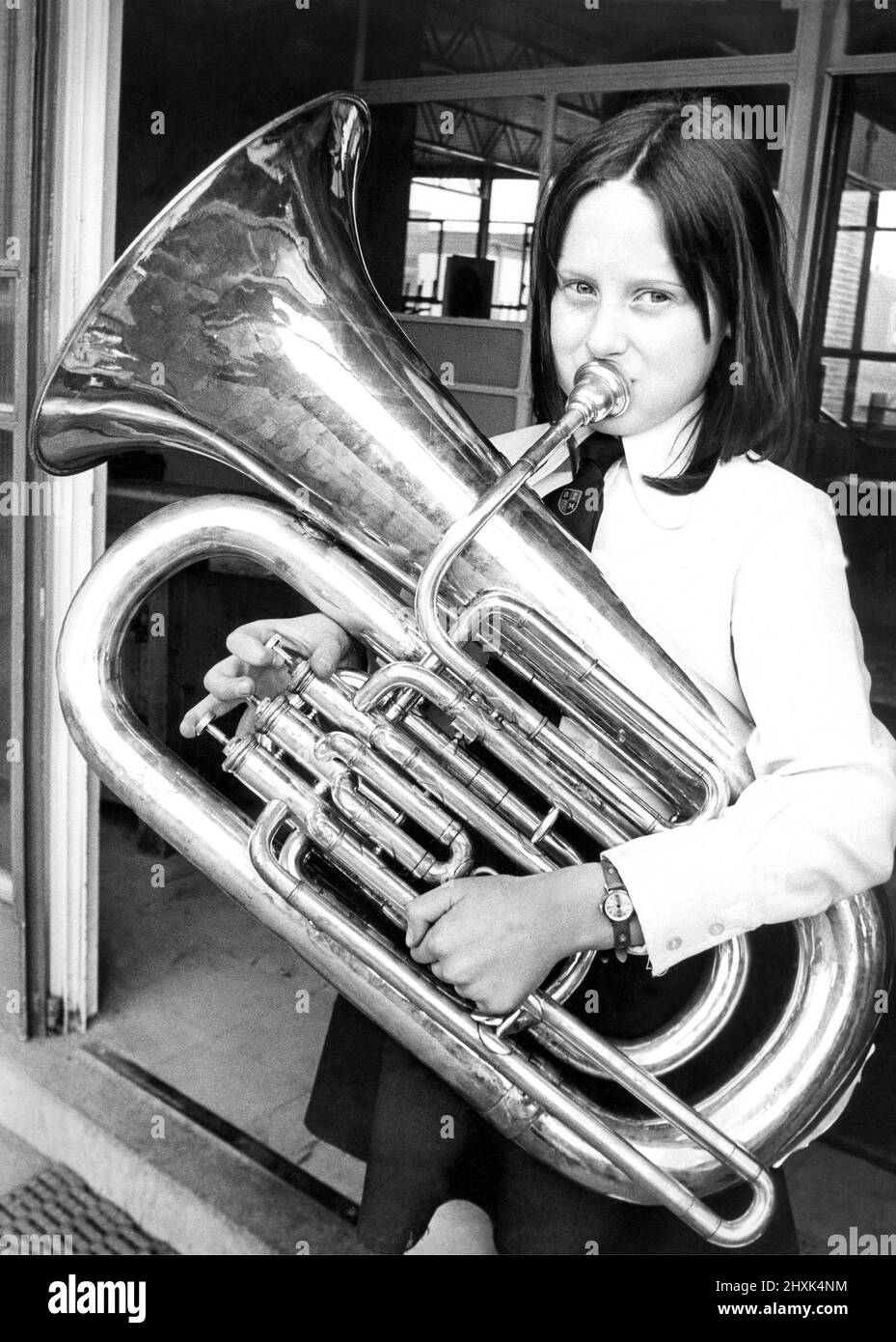 Nine year old Pamela Henderson rehearsing her part with her E-flat Bass ...