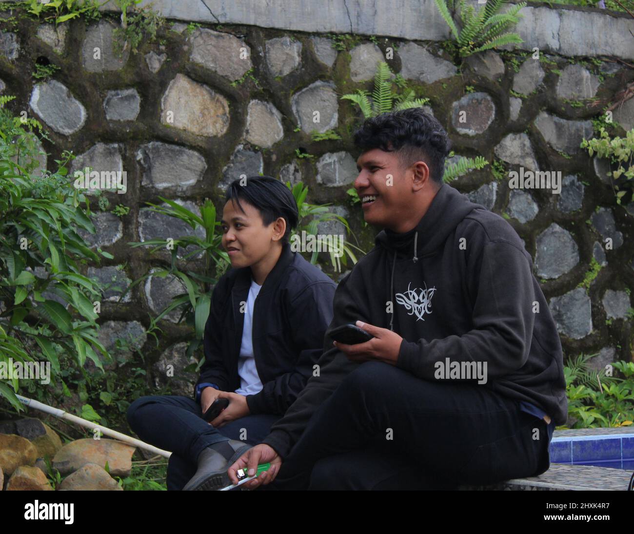 Bogor, Indonesia - 12 24 2020: several men are sitting smiling while on ...