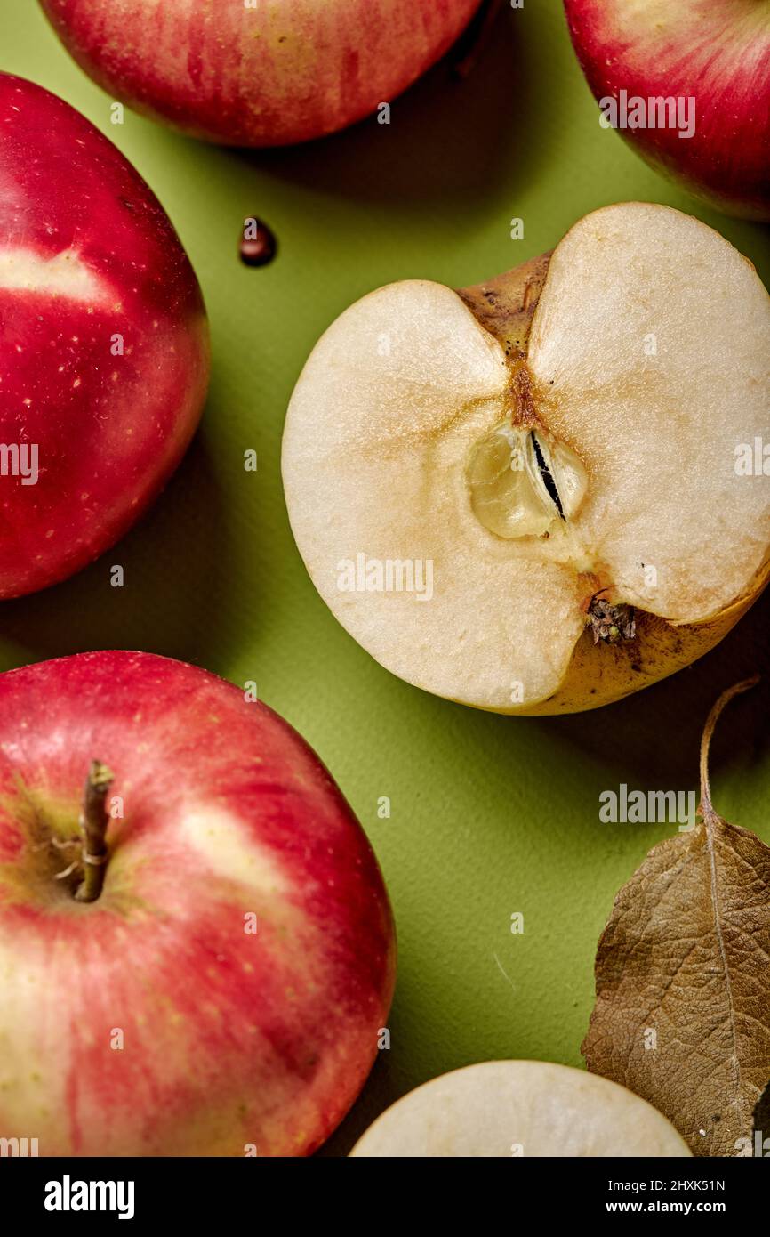 Fresh apple slices isolated on green background with clipping path and ...