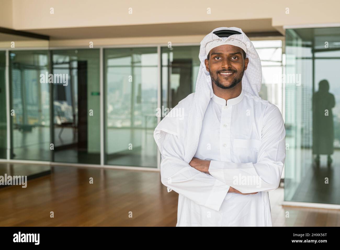 Portrait of young African Muslim man wearing religious clothing an ...
