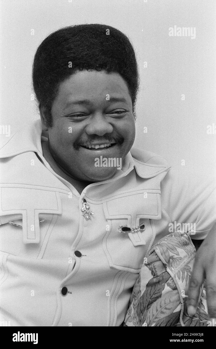 American rock and roll singer and musician Fats Domino shows off his ...