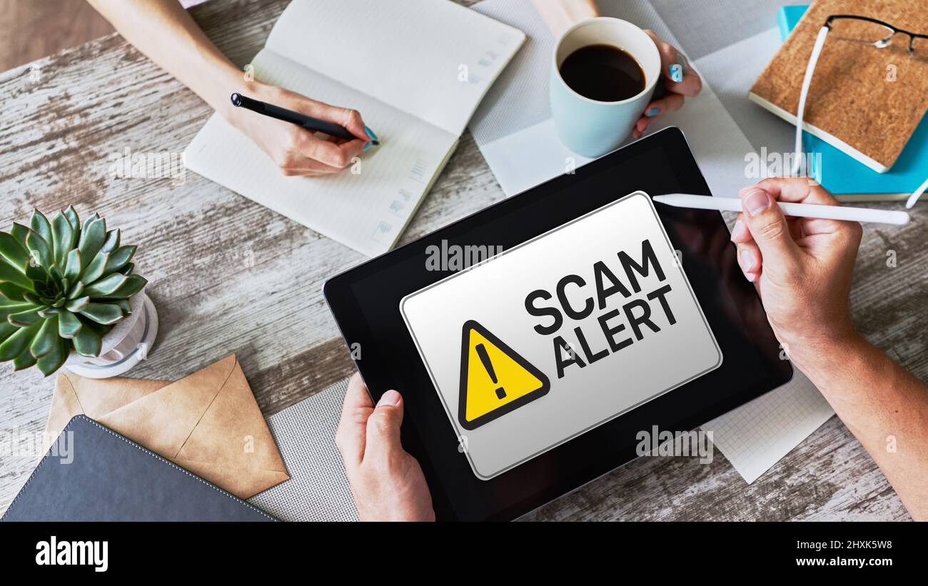 Scam alert detecting warning. Notification on device screen Stock Photo ...