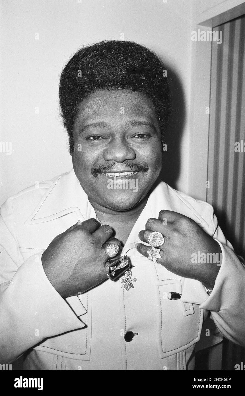 American rock and roll singer and musician Fats Domino shows off his ...