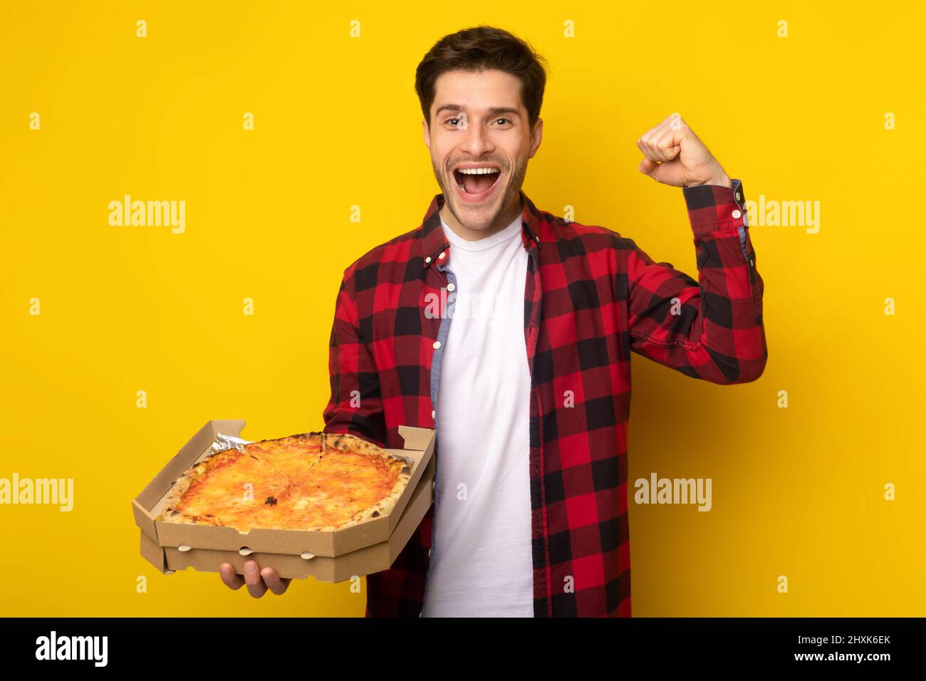 Funny Guy Holding Pizza Box Shaking Clenched Fist Stock Photo - Alamy