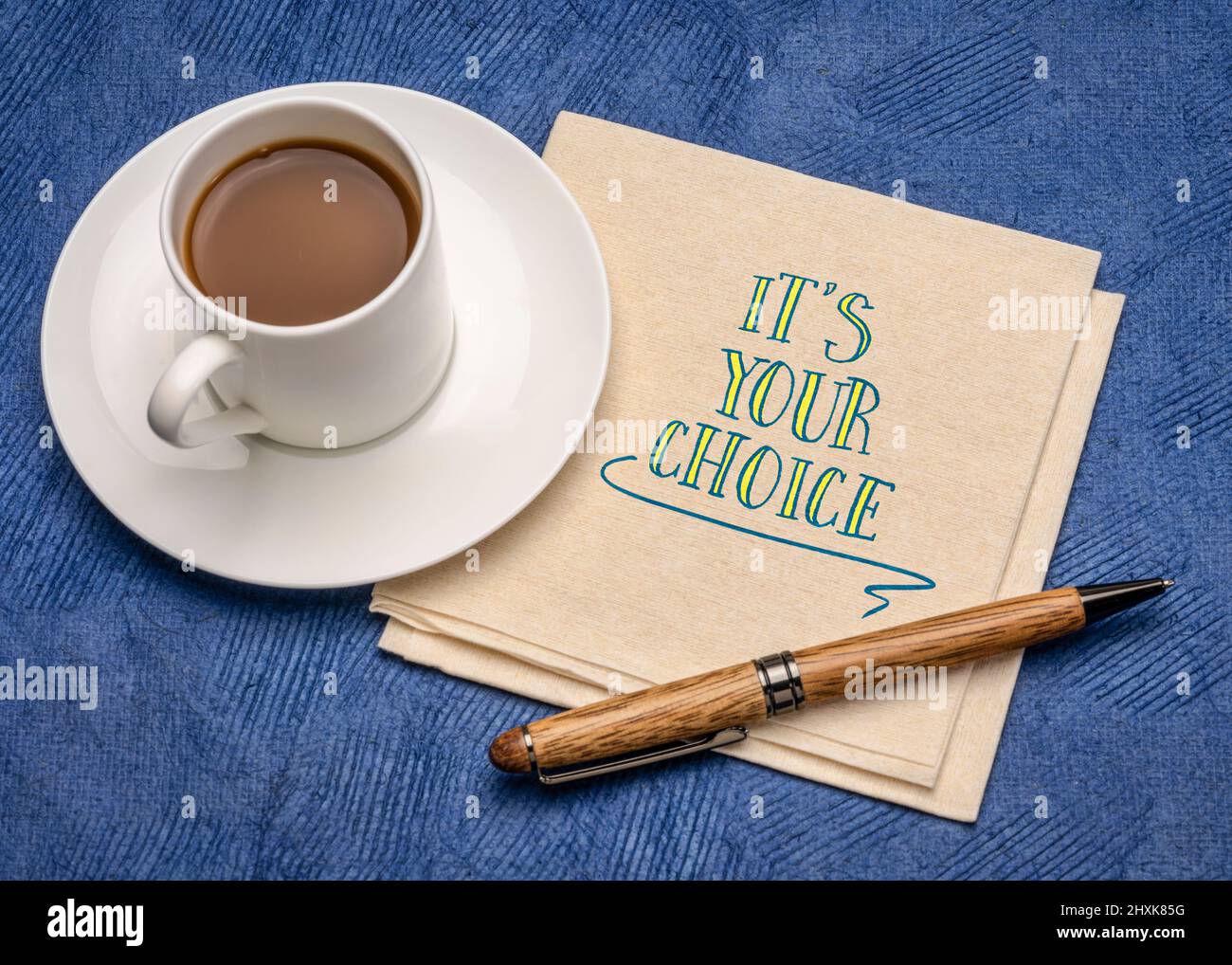 it is your choice reminder - handwriting on a napkin with coffee ...