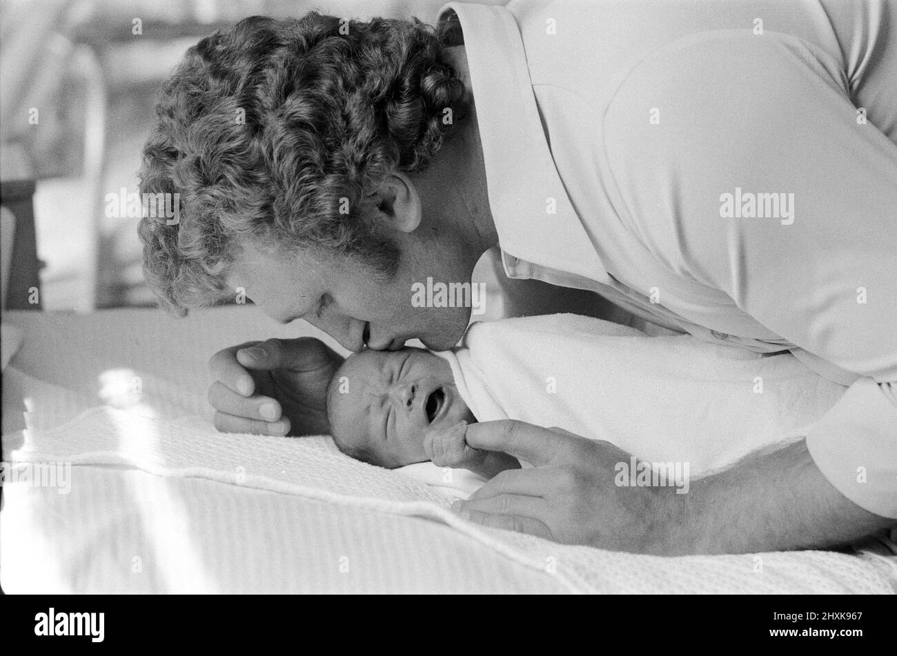 Former British European Heavyweight champion boxer Joe Bugner kisses ...
