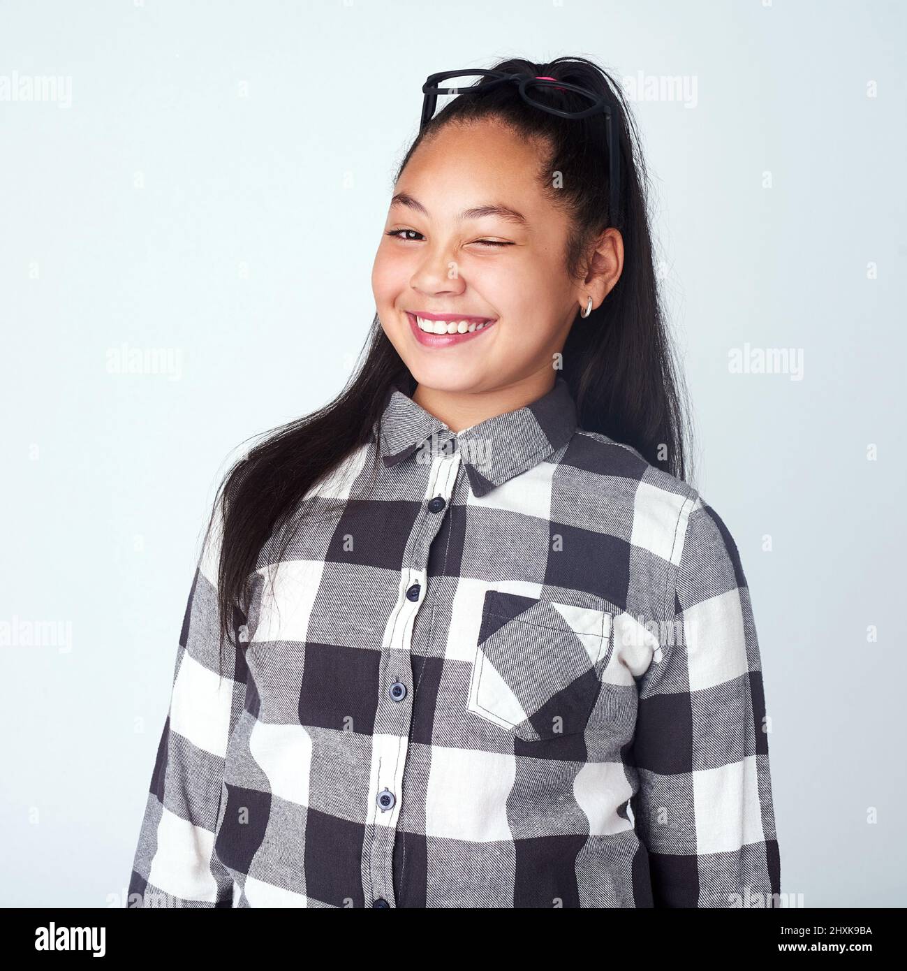 Nudge nudge, wink wink. Studio portrait of a cute and confident young ...