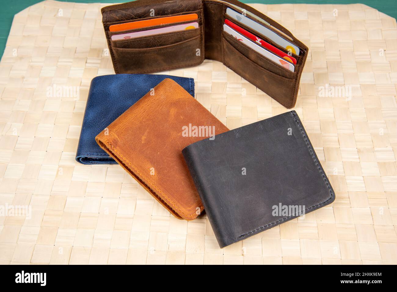 handmade men style leather wallets on a table Stock Photo - Alamy