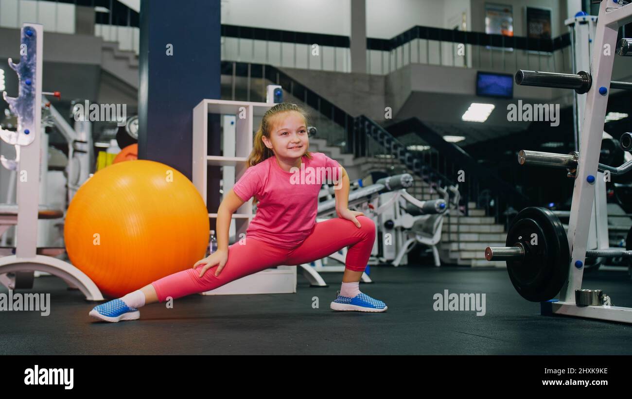 Fit Athletic Baby Girl Work out Stretching, Doing Her Fitness Exercise ...