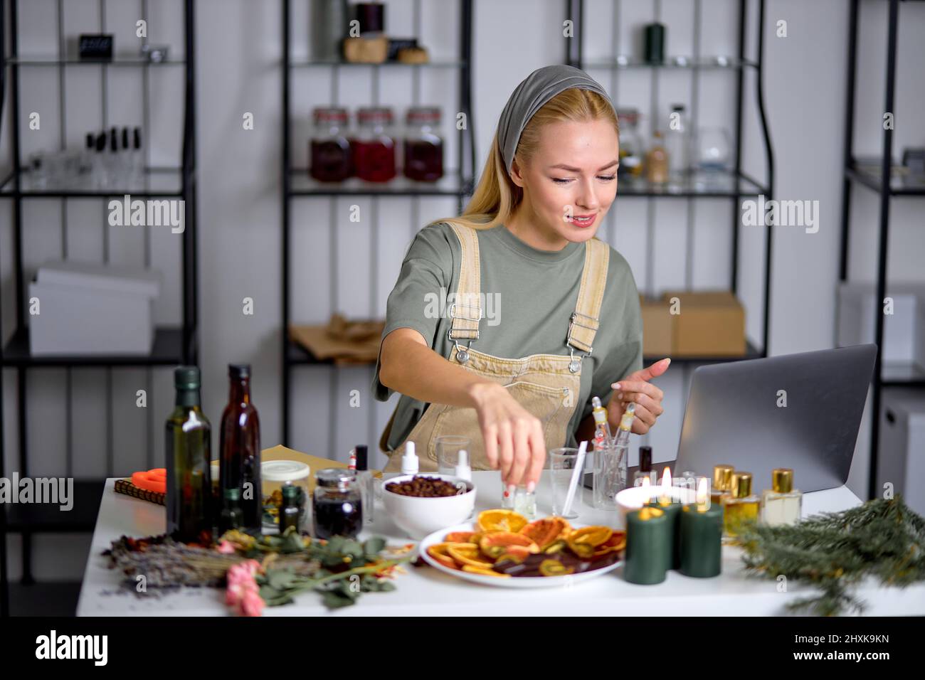 caucasian perfumer take bottle for mixing fragrance and essential oil ...