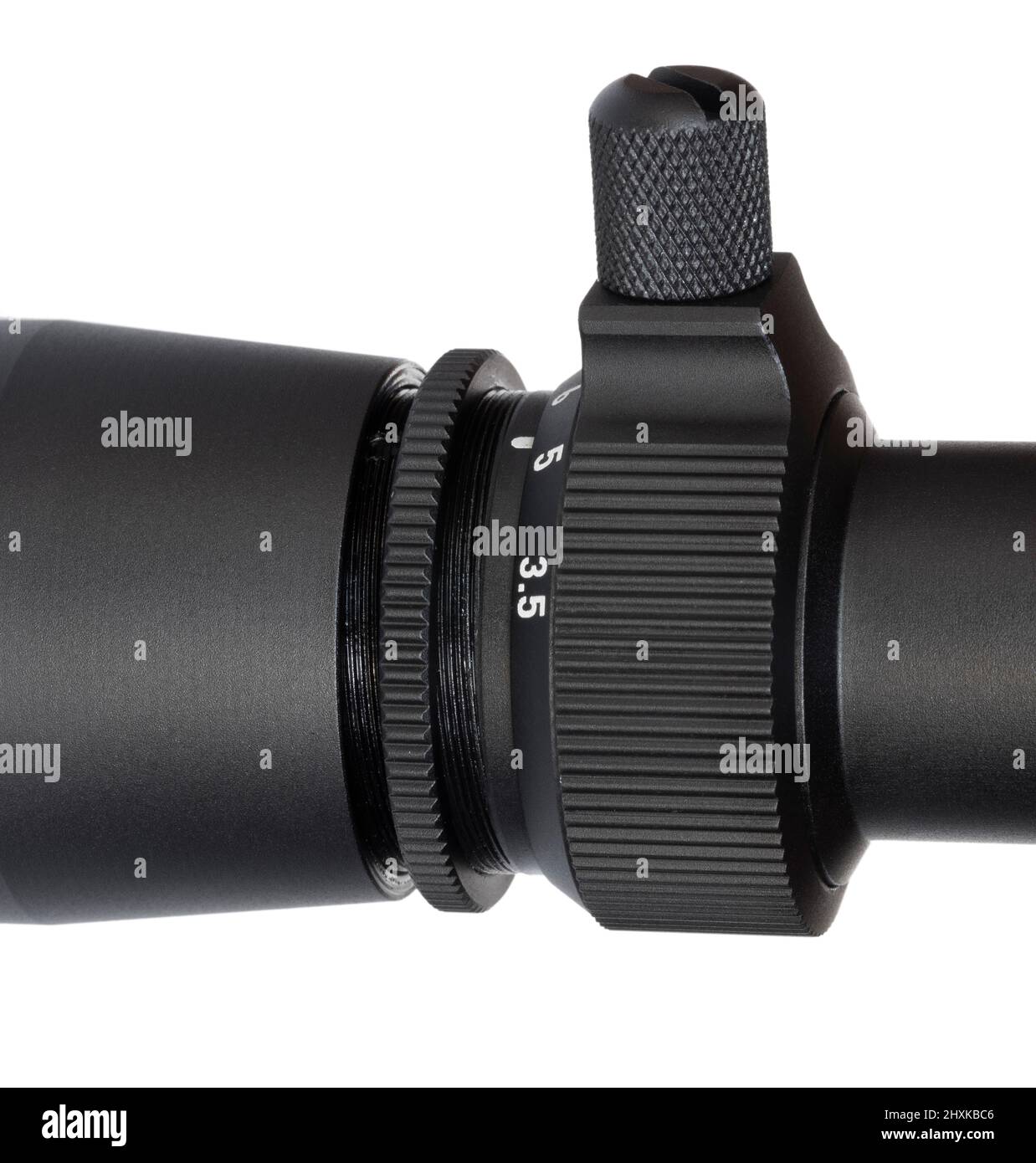 Magnification dial on a rifle scope and speed bump isolated on white ...