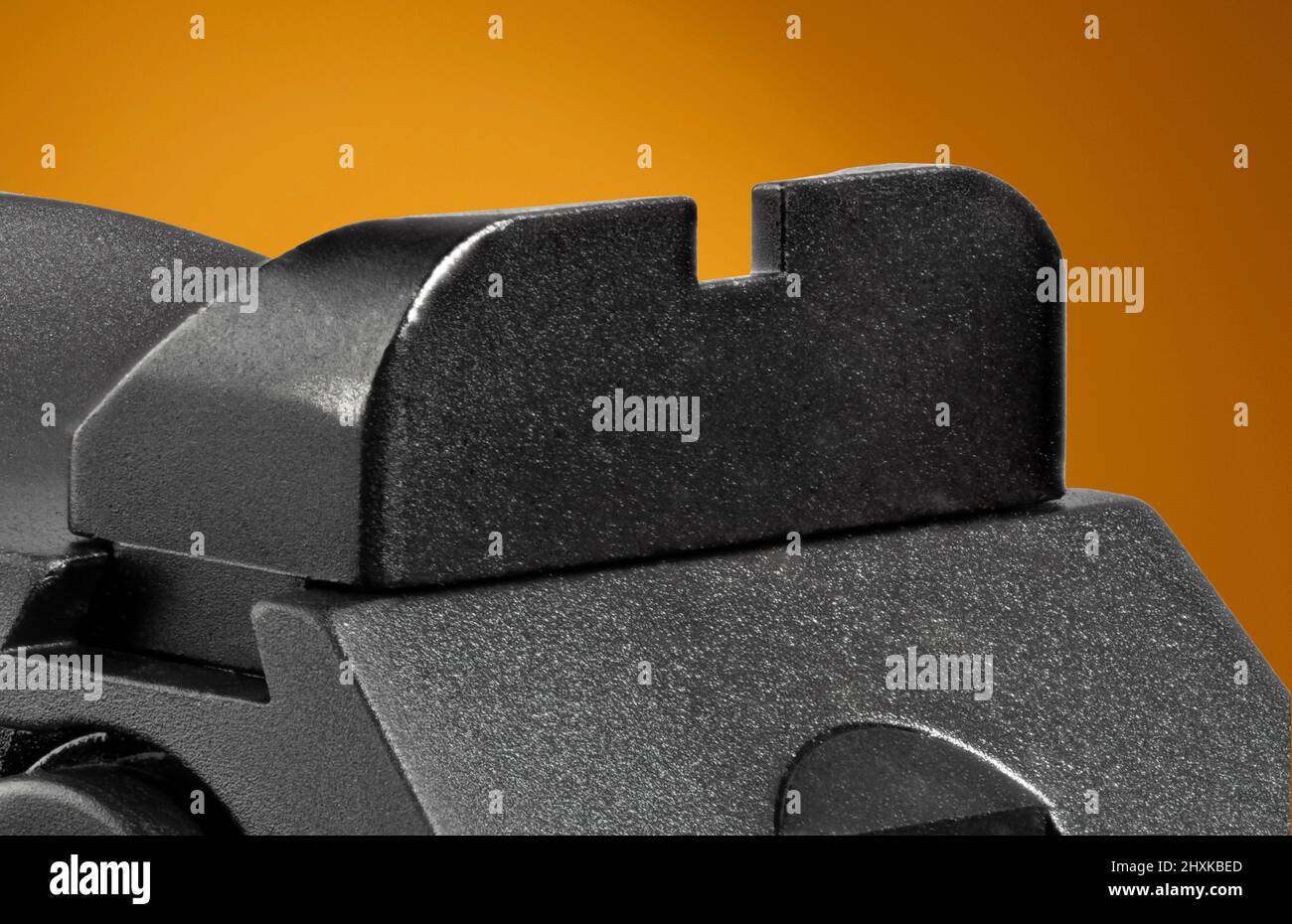 Notch that serves at the rear sight on a pistol with an orange ...