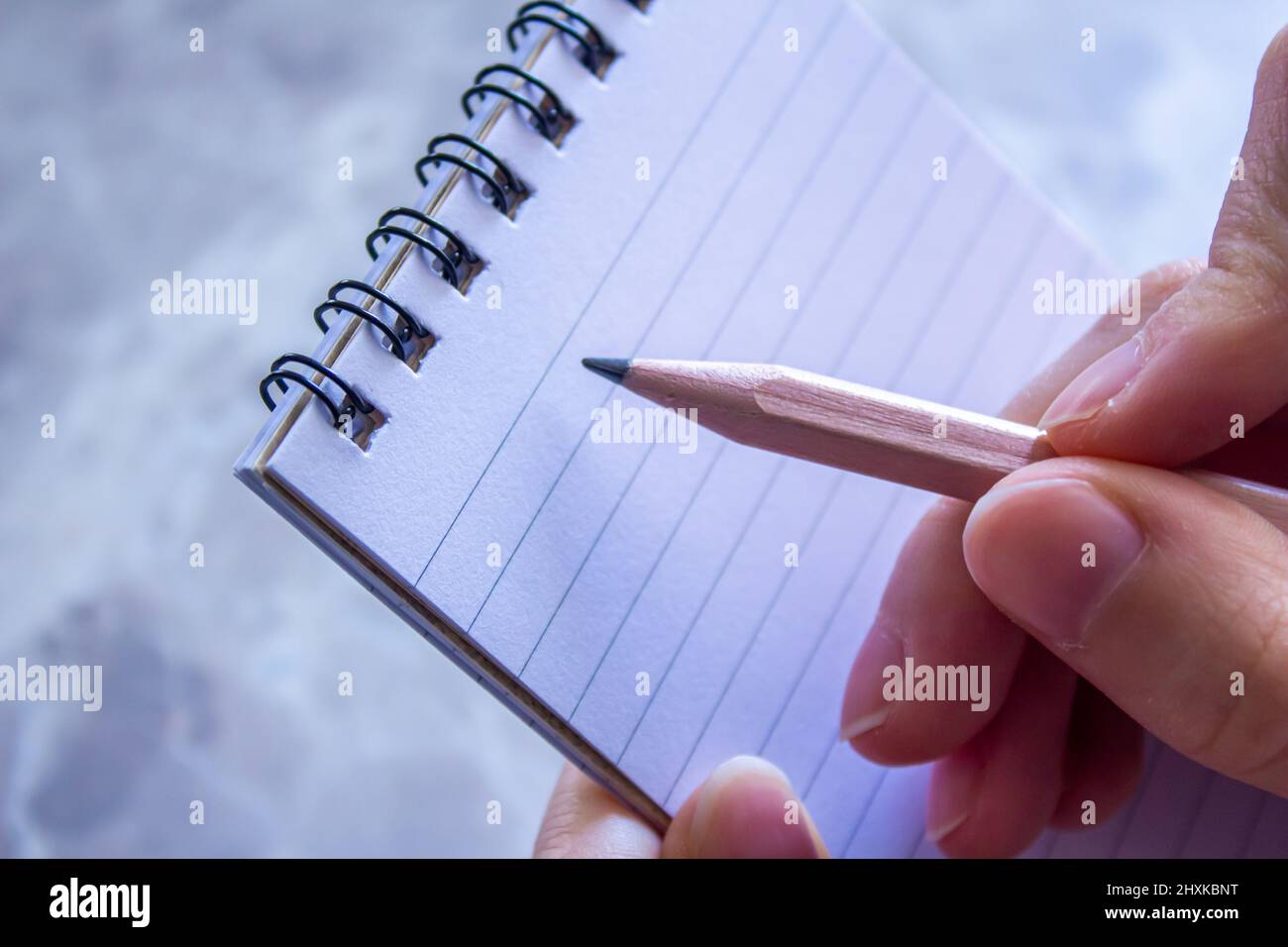 Closeup photo of woman hand taking notes on notebook page Stock Photo ...