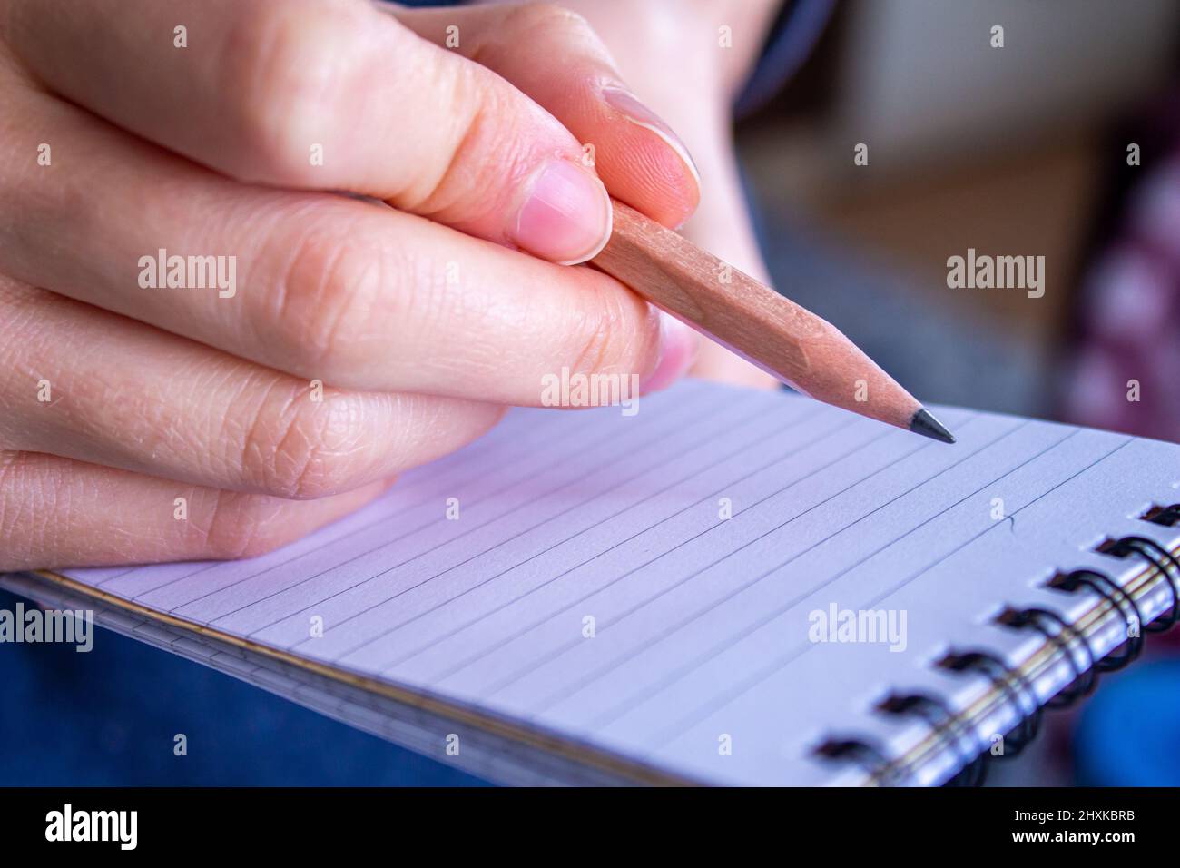 Closeup photo of woman hand taking notes on notebook page Stock Photo ...