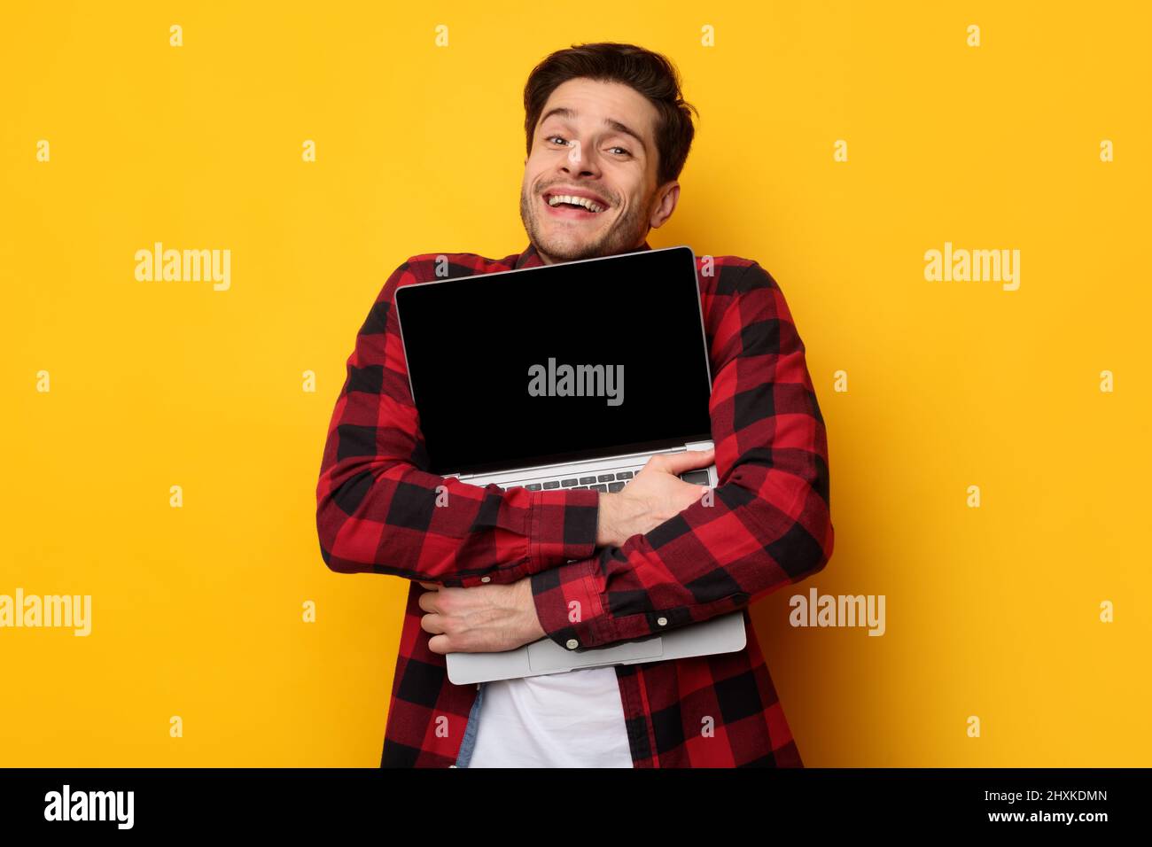 Hugging laptop hi-res stock photography and images - Alamy
