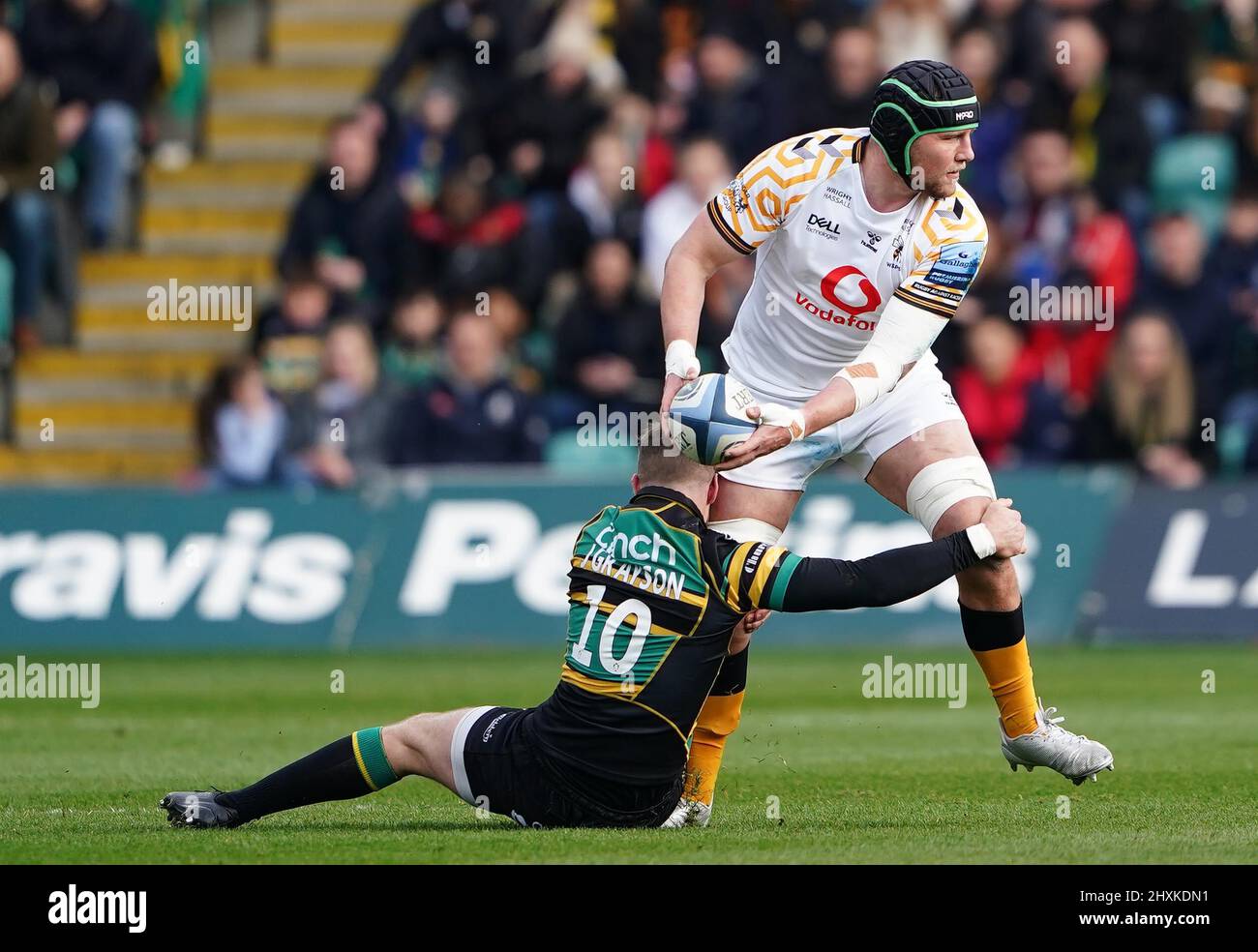 Northampton Saints' James Grayson (left) tackles Wasps' Tom Willis ...