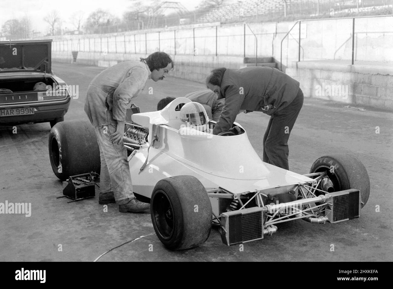 Racing driver John Surtees trying his new car. January 1976 76-00088 ...