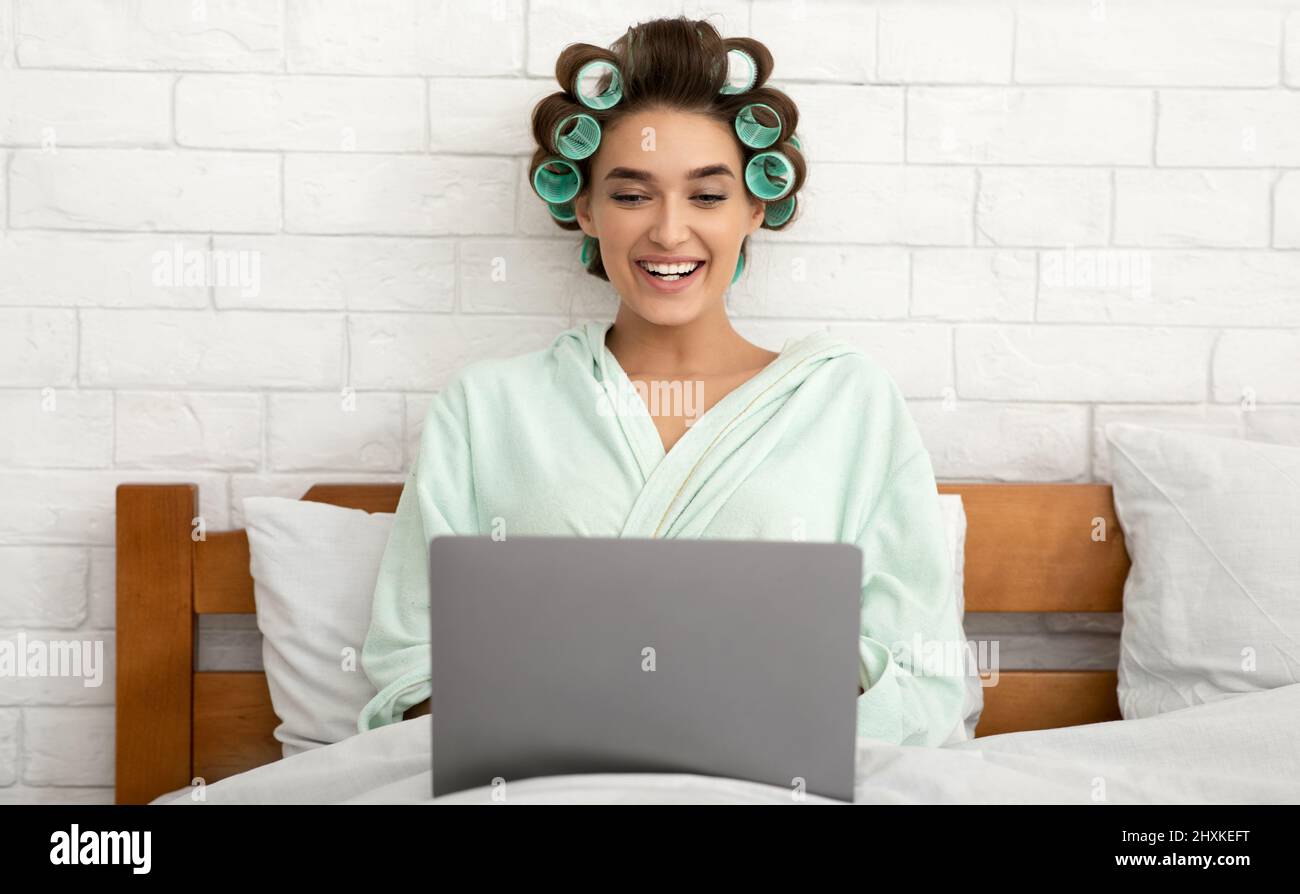 Happy Glamorous Lady Using Laptop Computer Working Online In Bedroom ...