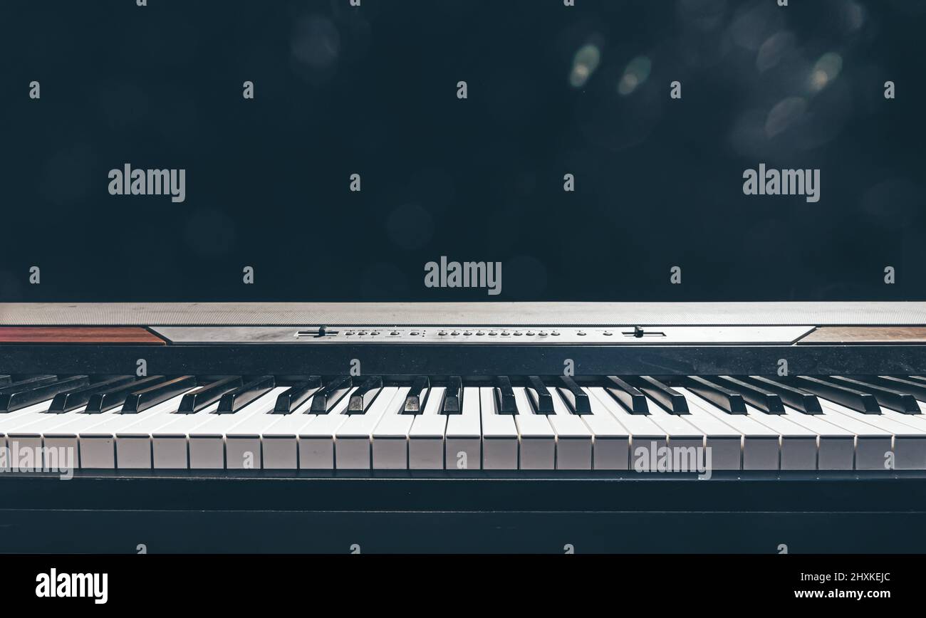 Piano keys isolated in the dark, copy space Stock Photo - Alamy
