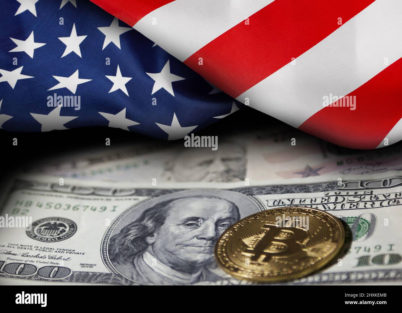 American flag on a Golden bitcoin coin on us dollars background for ...
