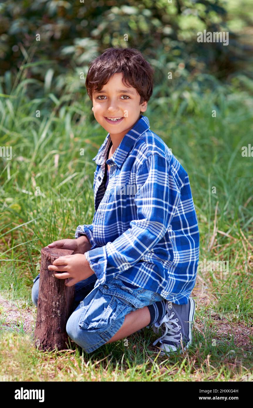 He really loves Nature. A young boy playing outside Stock Photo - Alamy
